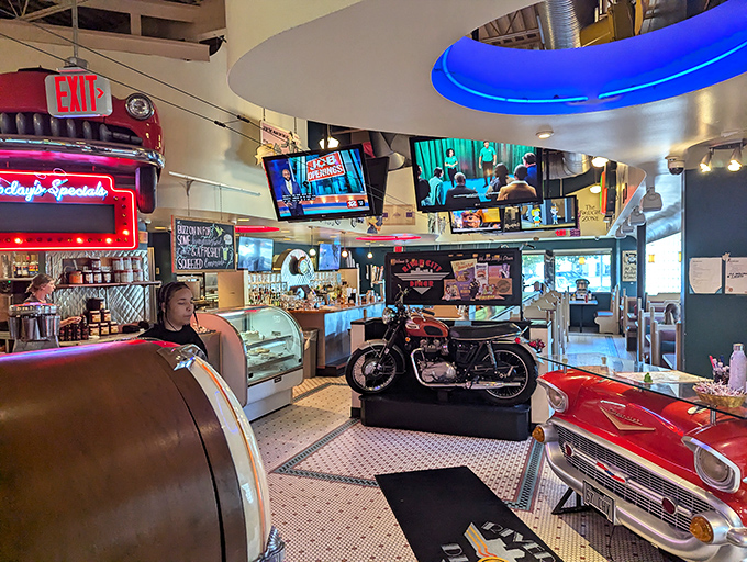 Where vintage meets vinyl in a neon-lit wonderland. This isn't just dining—it's dinner theater with motorcycles and memorabilia playing supporting roles.