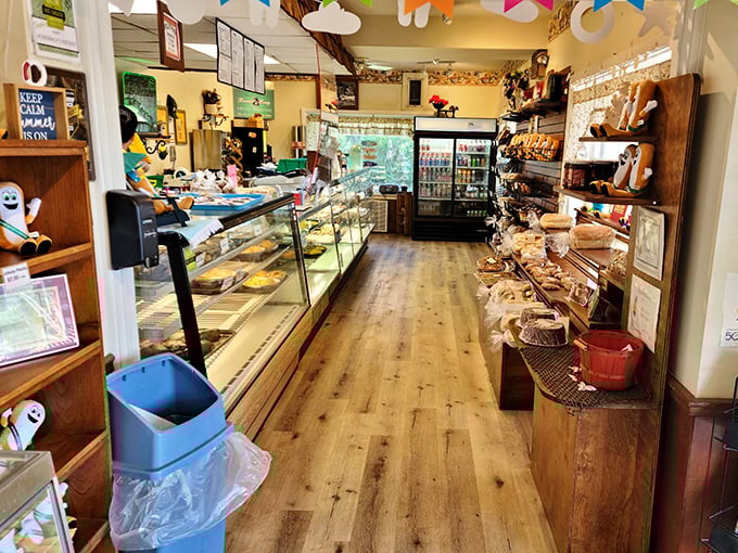 Step inside and follow the wooden floor to pastry paradise—where glass cases protect treasures more valuable than any jewelry.