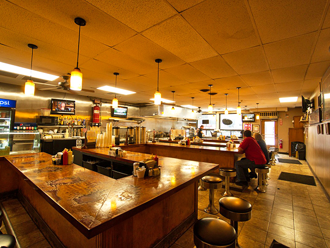 The horseshoe counter design isn't just practical—it's social engineering at its finest. Everyone feels like they're sitting at the cool kids' table.