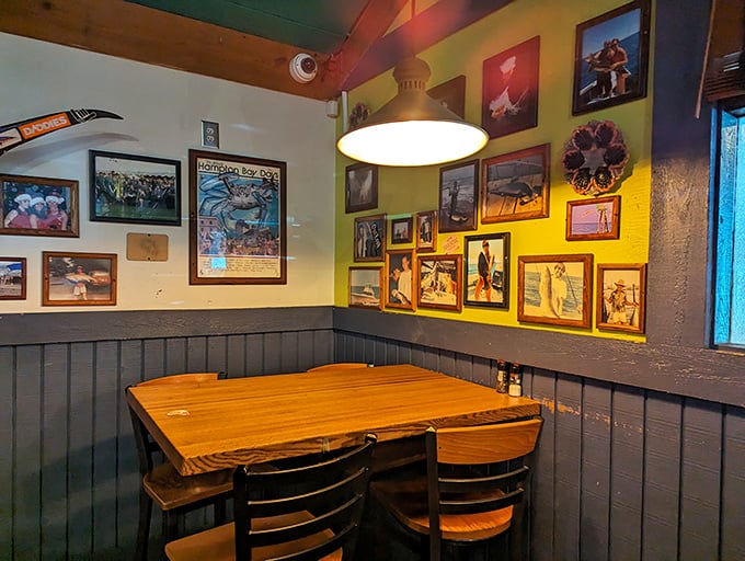 Wooden booths, exposed beams, and walls adorned with maritime memories create the perfect backdrop for seafood storytelling.