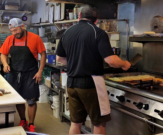 The kitchen crew working their griddle magic – no smoke and mirrors, just smoke and deliciousness.