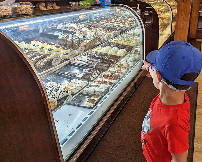 Even the youngest customers understand the gravity of dessert decisions at Presti's—choosing wisely requires careful study of the display case's treasures.