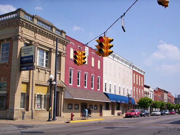 This main street view captures small-town America before chain stores decided to homogenize every corner.