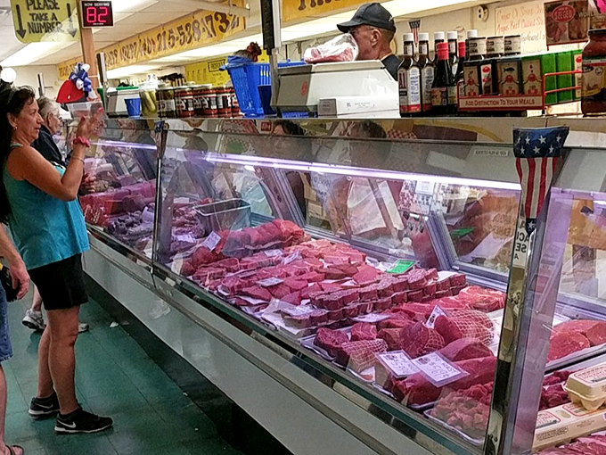 Meat counter magnificence – where butchers still know your name and can recommend the perfect cut for Sunday dinner without consulting a smartphone.