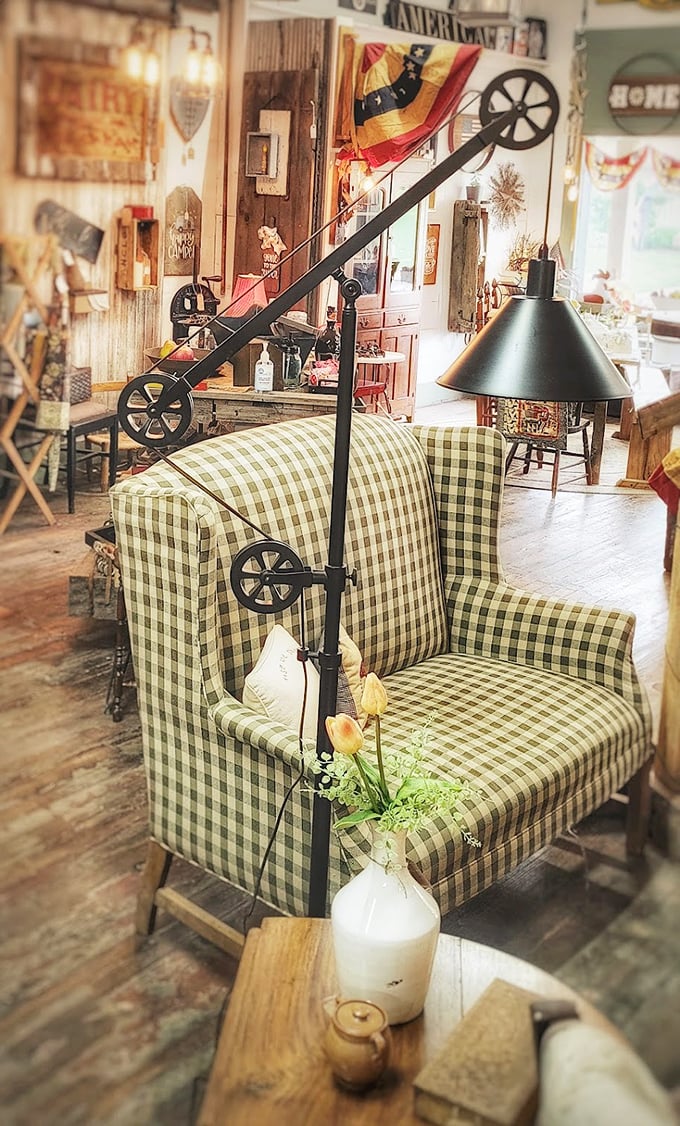 That green checkered chair isn't just offering a seat—it's inviting you to slow down and notice the details. Industrial lighting meets country comfort.
