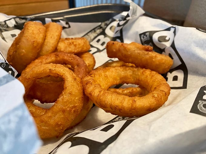 Onion rings with the ideal ratio of crispy coating to sweet onion interior. These aren't sides—they're main attractions in disguise.