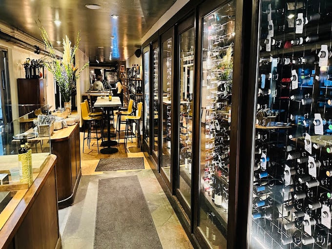 The wine display isn't just storage—it's a library of liquid stories waiting to be paired with your meal's next chapter.