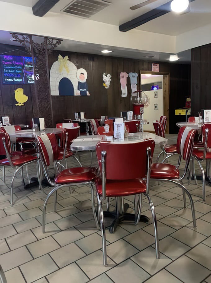 Red chairs, speckled tables, and whimsical wall decorations—this isn't interior design, it's a warm hug in restaurant form.