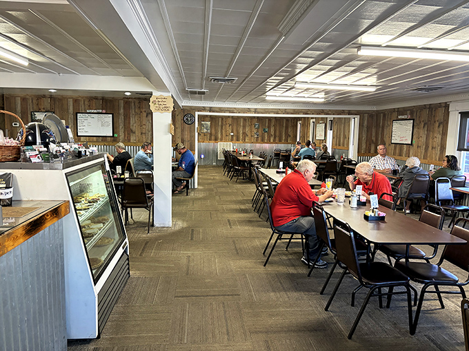 Wood paneling, corrugated metal accents, and tables filled with diners—this isn't interior design, it's the authentic backdrop for genuine Tennessee hospitality.