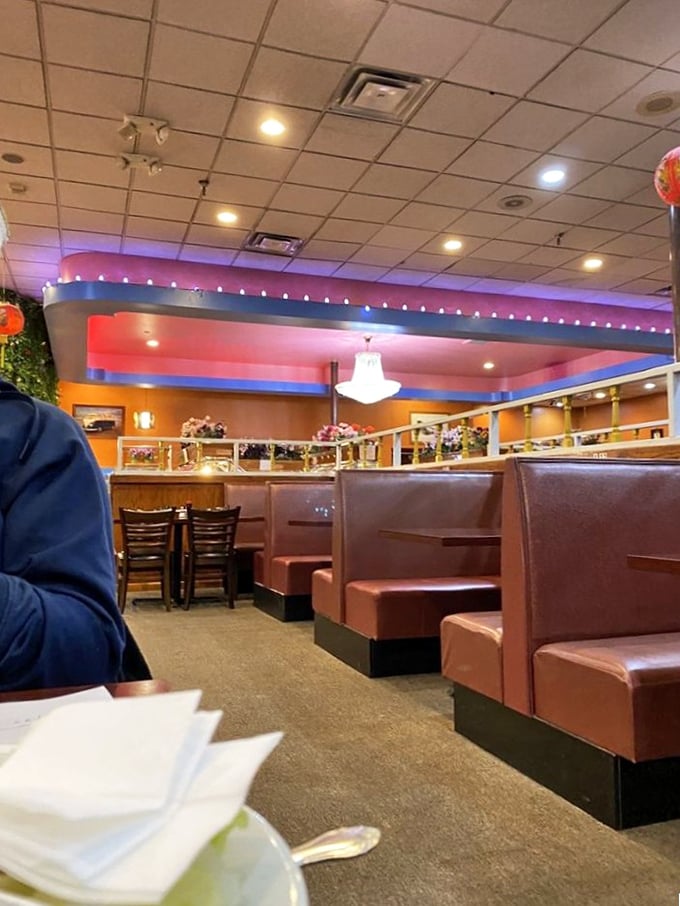 Cozy booths upholstered in that particular shade of restaurant red that somehow makes everything taste better. Comfort food deserves comfort seating.