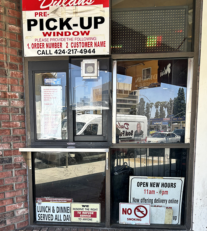 The pick-up window—where hungry souls line up for takeout salvation and the promise of leftovers tomorrow.