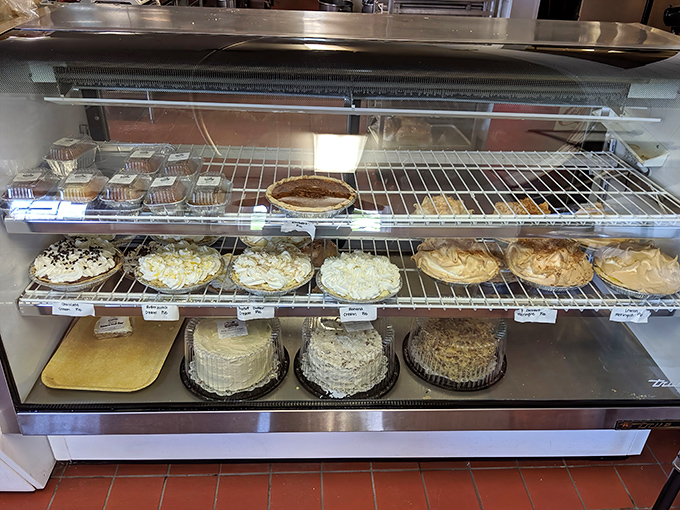 The pie case—or as I call it, "heaven's display window." Each perfectly crimped crust promises a different path to bliss. 