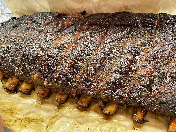 Ribs that showcase the primal pleasure of perfectly smoked meat. The kind of dish that makes you grateful for opposable thumbs and paper towels.