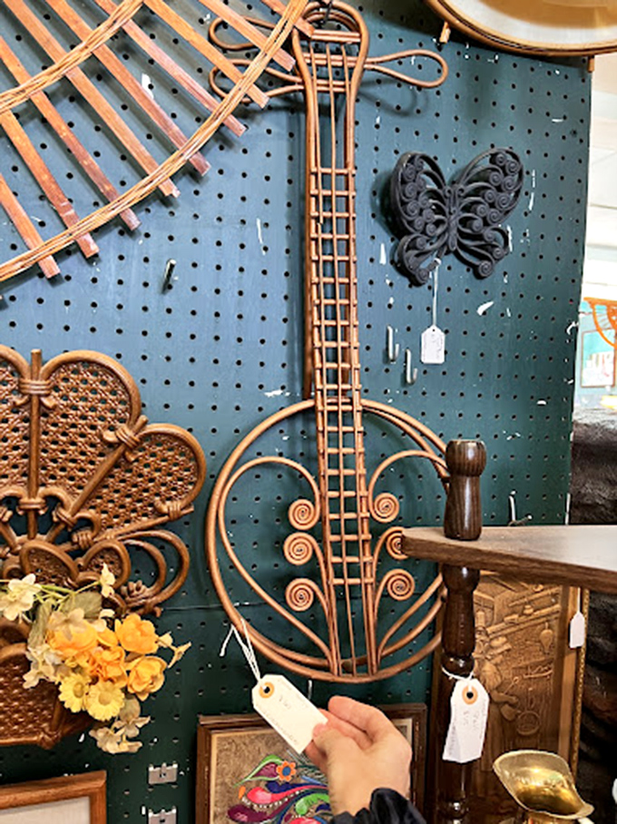 This isn't just wall art—it's a rattan guitar that never played a note but somehow still carries the soul of 1970s design in every woven strand.