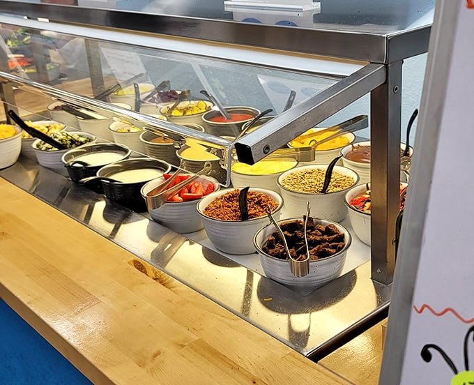 A prep station loaded with fresh toppings stands ready for action—the breakfast equivalent of an artist's palette waiting to create morning masterpieces.