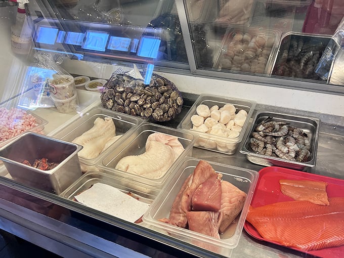 The fish market display case—where tomorrow's dinner meets today's lunch. An underwater treasure chest of Pacific delights.