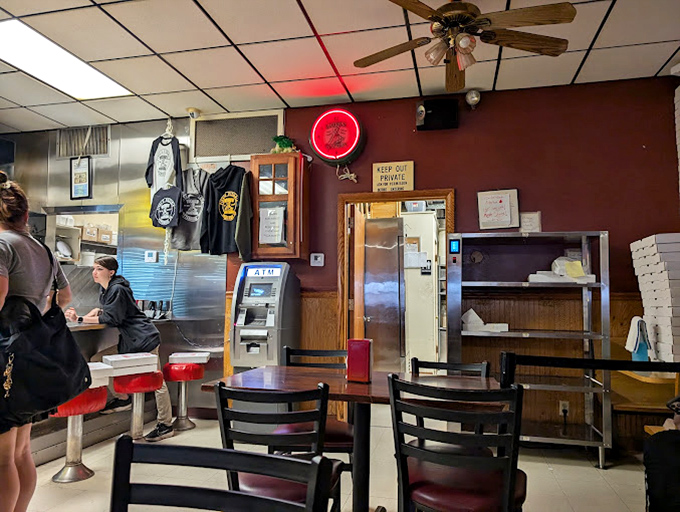 The dining area—where strangers become neighbors and neighbors become friends—all united by the universal language of "pass the red pepper flakes."