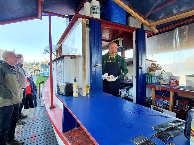 The ordering window frames friendly faces ready to deliver your dose of fried happiness.