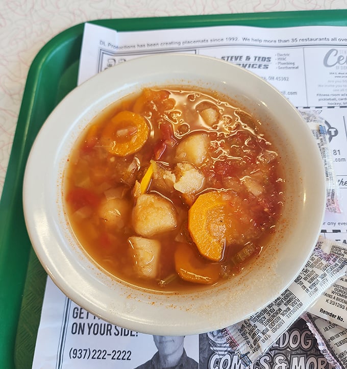 A bowl of vegetable soup that doesn't need Instagram filters—just a spoon and the good sense to appreciate honest cooking.