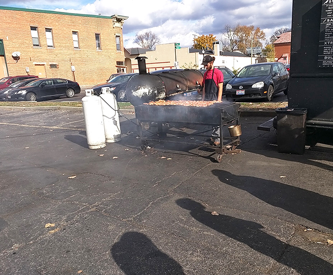 The unsung heroes of barbecue stand vigilant by their smokers, tending the fires with the patience and precision of artists creating edible masterpieces that will disappear within minutes.