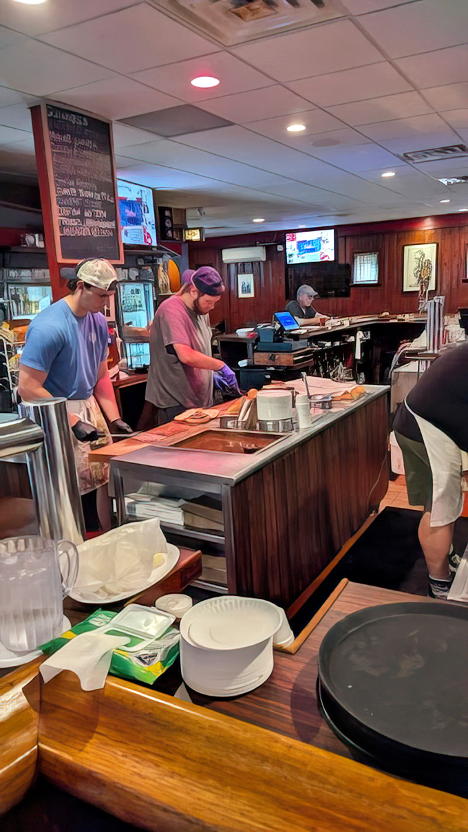 The kitchen crew in their element—craftspeople creating comfort food classics with the precision that only comes from years of practice.