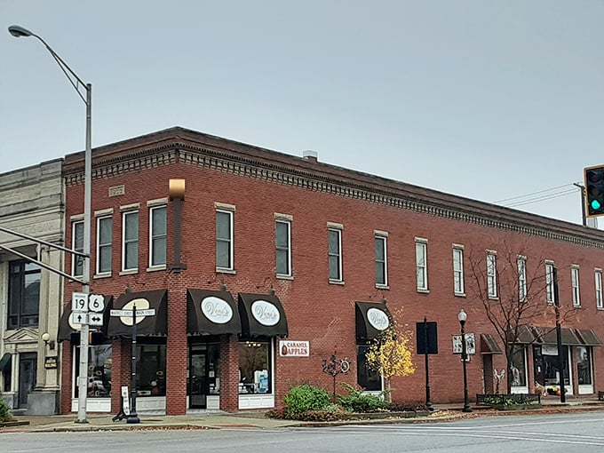 Red brick beauty with awnings that welcome. These historic buildings don't just house businesses – they frame the daily life of a community.