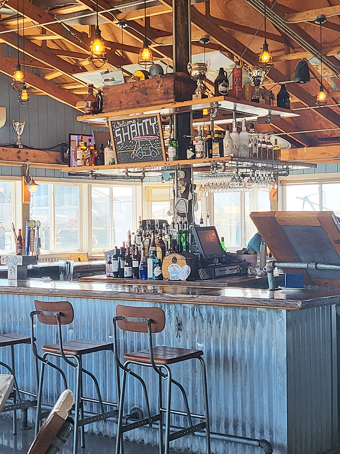 The bar at The Shanty isn't just serving drinks—it's offering front-row seats to the evening's sunset performance over Cape Charles Harbor.
