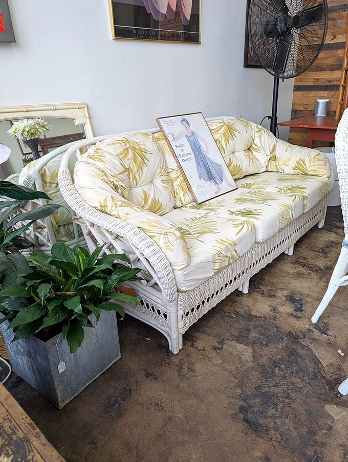 This wicker sofa with tropical cushions isn't just furniture—it's a vacation for your living room. Golden palms included, no sunscreen required.