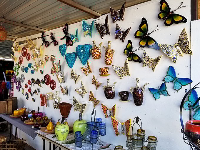 Wall-mounted butterflies and decorative hearts transform simple stalls into galleries of folk art. These aren't mass-produced decorations—they're expressions of borderland creativity.