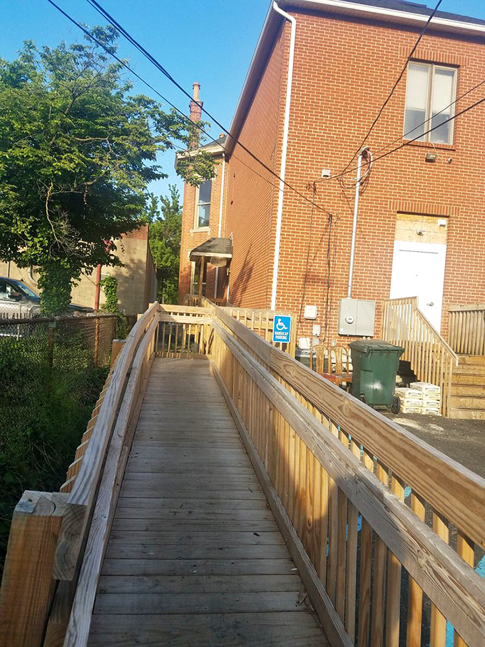 The wooden ramp entrance feels like the pathway to barbecue enlightenment—each step bringing you closer to smoked meat nirvana.