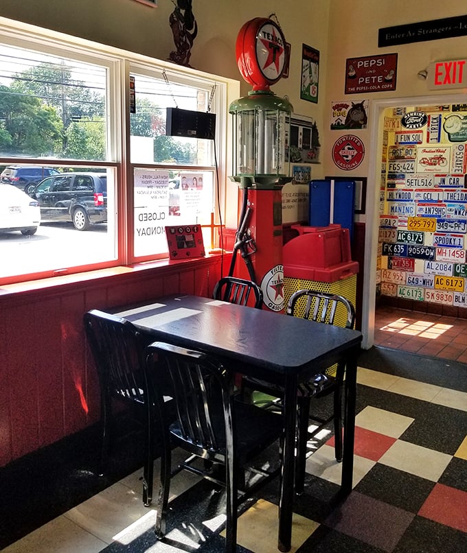 The license plate collection and vintage gas pump create the perfect backdrop for enjoying comfort food classics in this corner of hot dog paradise.