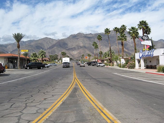 Borrego Springs' main street stretches toward mountain vistas, offering desert retirement living at prices that won't drain your savings.