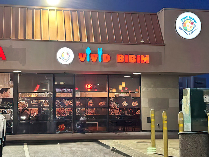 Vivid Bibim's bright signage pops against the strip mall backdrop, promising Korean comfort food that lives up to its colorful name.