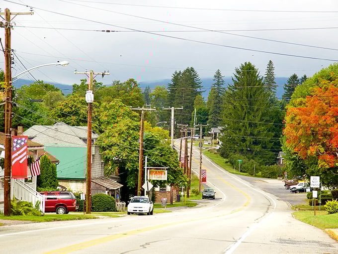 Rolling hills, American flags, and tree-lined streets—this peaceful Bedford road is pure Pennsylvania beauty with a cozy hometown vibe.