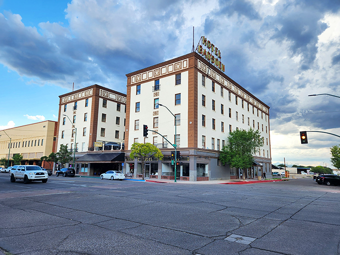 The iconic Gadsden Hotel stands tall under dramatic skies, offering a glimpse into the rich history of Douglas.