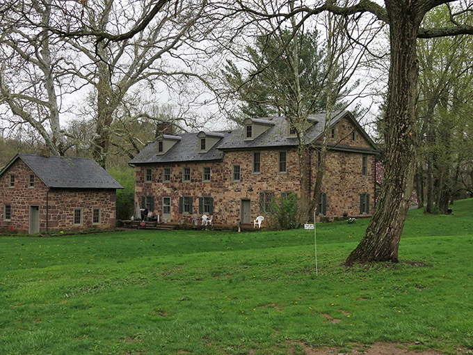 Stone buildings nestled among trees—built to last longer than those warranties you never remember to mail in.