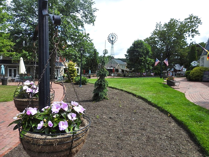 Charming garden area with flowers and a windmill at Peddler's Village. Where your credit card goes for a scenic workout!
