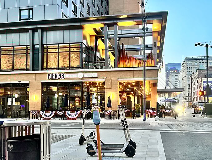 City lights frame Pier 48's inviting entrance at dusk. Where downtown energy meets seafood serenity – no passport required!