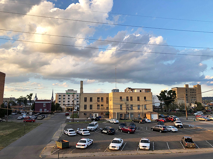 Golden light bathes this river town in warmth, highlighting the beauty of honest working communities.