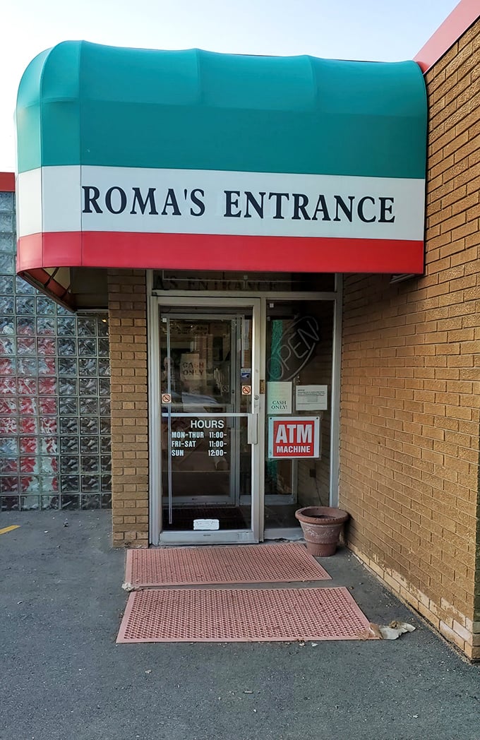 The Italian flag colors above Roma's entrance aren't just decoration – they're a promise of the old-world flavors waiting inside.