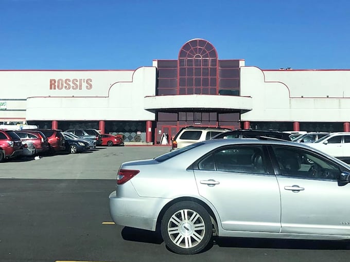 Rossi’s expansive lot fills with cars as shoppers stream into its bustling weekend market.