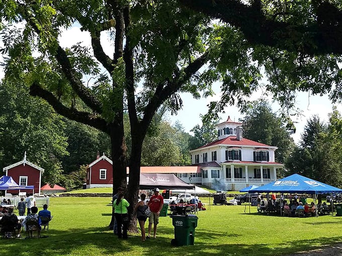 The historic white house in Sautee Nacoochee Valley hosts community gatherings under ancient trees – Norman Rockwell couldn't have painted it better.
