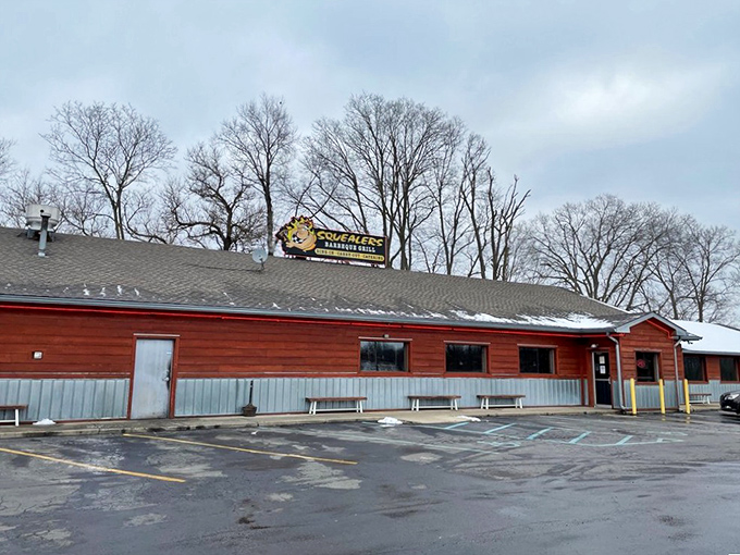 That happy pig on the sign isn't just cute—it's making a bold promise about the pork paradise waiting inside this rustic BBQ haven.