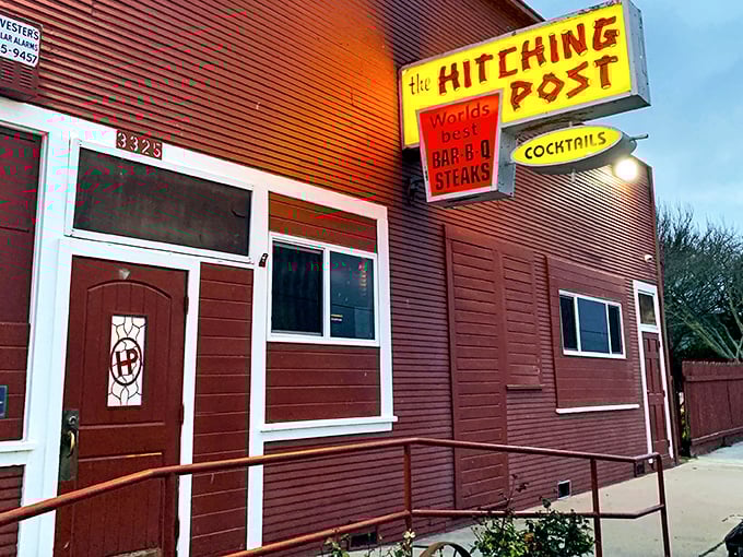 That vintage sign isn't retro design—it's authentic history smoking with confidence. The Hitching Post doesn't follow BBQ trends; it set them before most of us were born.