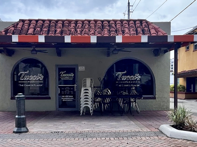 Tucci's Fire N Coal Pizza: Small building, big flavors – where coal-fired magic happens behind those unassuming arched windows.