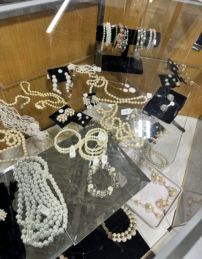 Pearl necklaces and vintage brooches glimmer under glass like treasures from your stylish grandmother's jewelry box. Elegance never goes out of style.