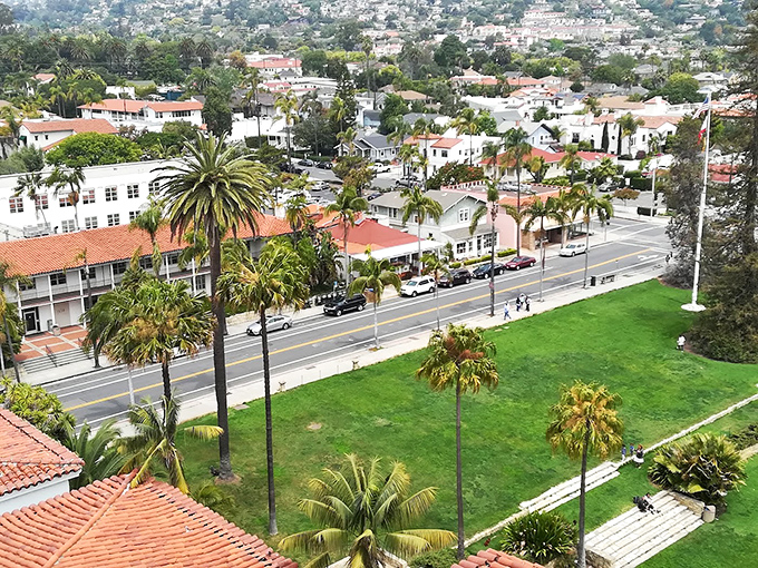 From above, Santa Barbara reveals its perfect urban planning: a red-tiled roofscape nestled between mountains and sea like it was always meant to be there.