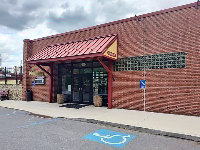 Brick, accessibility, and a welcoming red awning—the architectural equivalent of a firm handshake. Whatever happens inside must be worth the visit.
