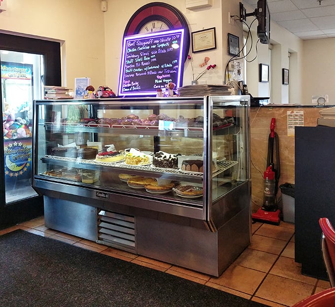 The dessert case—Pennsylvania's version of the Louvre. Each shelf a gallery of sweet masterpieces that make willpower crumble faster than their crusts.