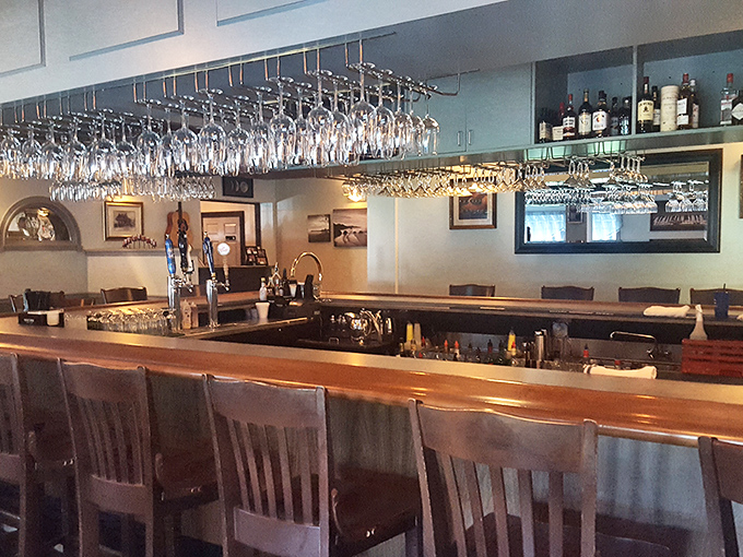 The bar isn't just where drinks are served – it's command central for an evening of seafood indulgence, with wine glasses standing at attention.